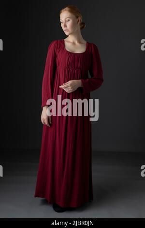A working class Regency woman wearing a red dress Stock Photo - Alamy