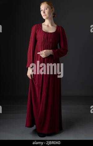A working class Regency woman wearing a red dress Stock Photo - Alamy