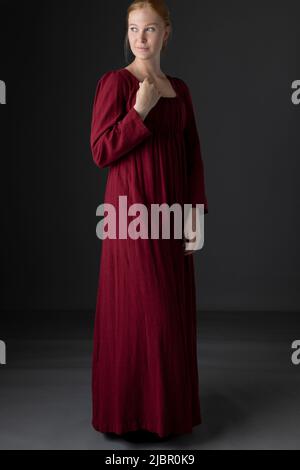 A working class Regency woman wearing a red dress Stock Photo - Alamy
