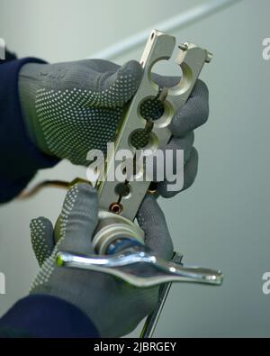 Worker hands fitting clamps for cables of an air conditioner Stock ...