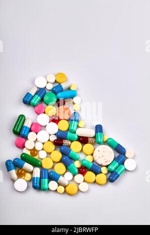 Heart made of white heart shape tablets isolated on white background ...