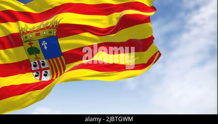 Aragonese flag waving in the wind on a clear day. Aragon is an ...