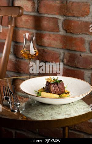 Grilled pork medallion with tomato sauce served rosemary Stock Photo ...