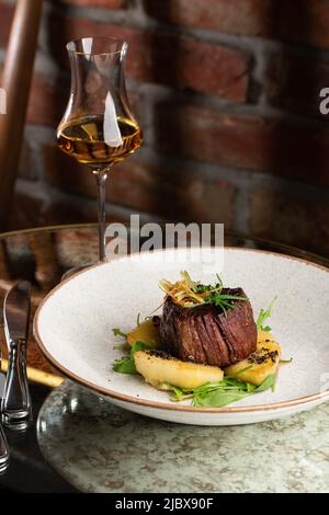 Fillet Steak medallion with vegetables on a plate Stock Photo - Alamy
