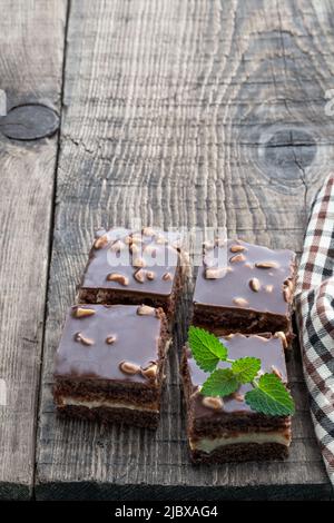 Chocolate brownie portions on wooden background Stock Photo - Alamy