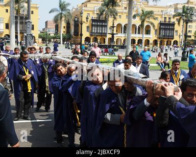 Devotees carrying in procession the Crucifix of Fray Pedro de la ...