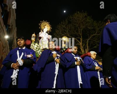 Penitents carrying a religious litter with an image of Crucified Christ ...
