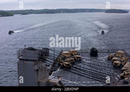 Two Swedish CB90-class fast assault crafts transit towards the well ...