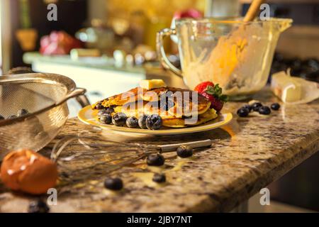 Messy kitchen counter after making blueberry pancakes Stock Photo - Alamy