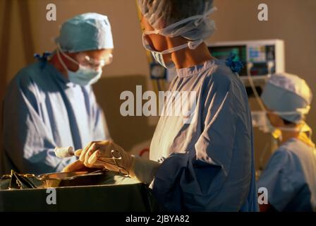 Nurses assisting doctor in theatre of hospital with operation Stock ...