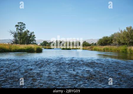 Fly fishing POV looking down a river Stock Photo - Alamy