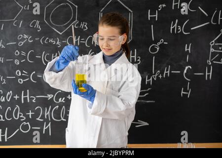 Little girl doing science experiment. Kindergarten. Education concept ...