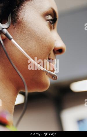 Headset woman in profile - closeup on white background Stock Photo - Alamy