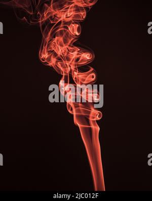 Wisp of red smoke spiraled abstract steaming maroon background, steam ...