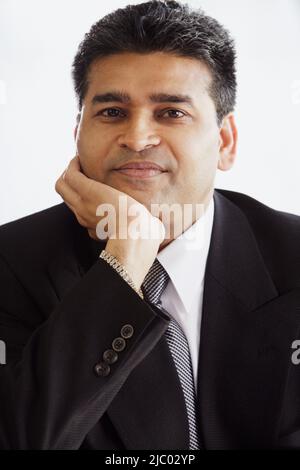 Front closeup view of businessman hand holding three wooden cubes ...