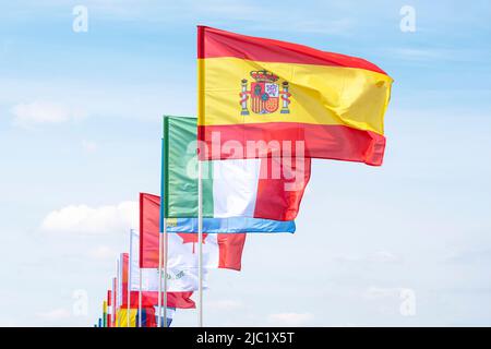 Flags of different countries of world flutters in wind background of ...