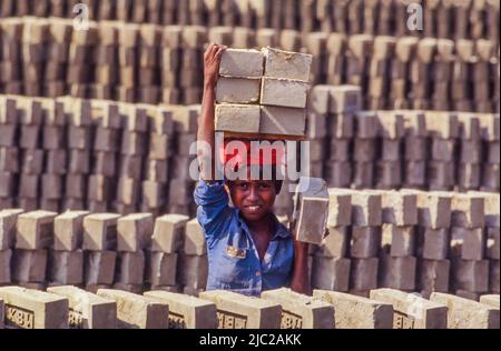 Child workers carry bricks carrying it on his head in Sonakhali, West ...