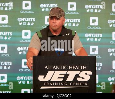 New York Jets special teams coordinator Chris Banjo talks to reporters ...