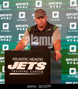 New York Jets special teams coordinator Chris Banjo talks to reporters ...