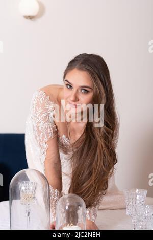 The bride crawls on the table like a cat. High quality photo Stock ...
