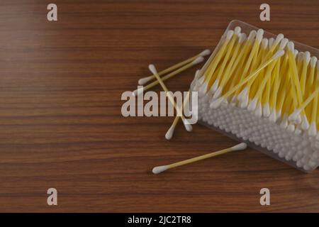 Yellow cotton swabs scattered on the surface Stock Photo - Alamy
