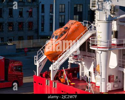 orange free-fall life boat for emergency evacuation Stock Photo - Alamy