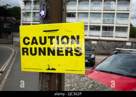 Caution runners sign Stock Photo - Alamy