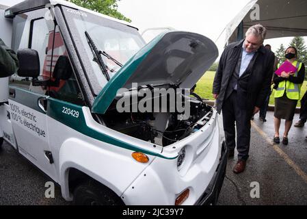 Canada Post CEO Doug Ettinger ducks under the lift gate of a Westward ...