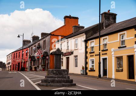 The 13th - 14th Century Market Cross - and Quiet Man Pub behind, Cong ...