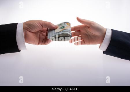 Businessman giving and receiving US dollar banknote money Stock Photo ...