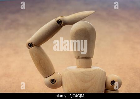 Hand making a gesture on a wooden background Stock Photo - Alamy