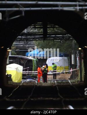 File photo dated 10/11/16 of investigators at the scene after a tram ...