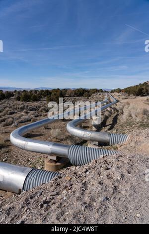 Steam and hot water pipelines feeding a geothermal plant Stock Photo ...