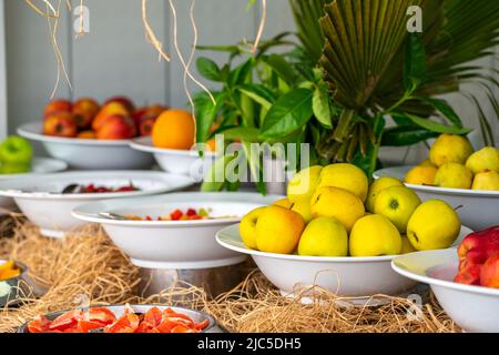 Assortment of different kind of fresh apples on the table in buffet ...