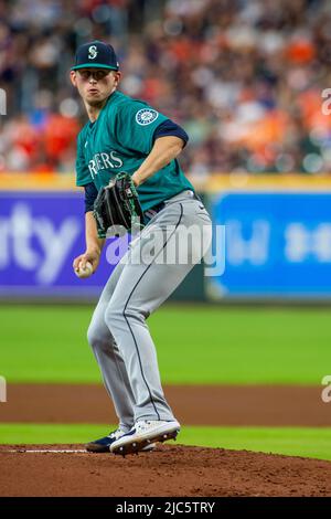 Seattle Mariners starting pitcher Chris Flexen pauses in the dugout ...