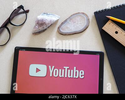 In this photo illustration a Youtube logo seen displayed on a ...