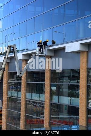 high rise building Window maintain the glass facade of a modern ...