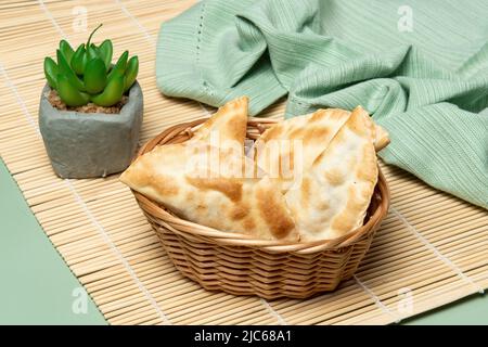 portion of bar meat pastries in a green background Stock Photo - Alamy