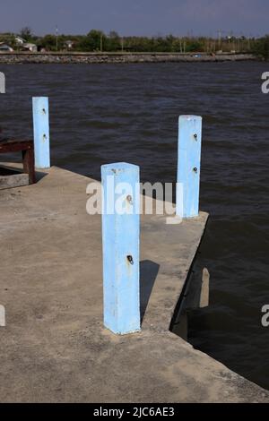 Concrete pole with chains hooks on jetty, Blue Jetty pole, Blue ...