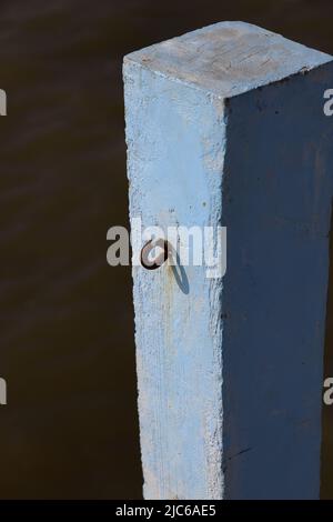Concrete pole with chains hooks on jetty, Blue Jetty pole, Blue ...