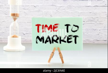 Notepad with text Time To Invest on Market charts and pen Stock Photo ...