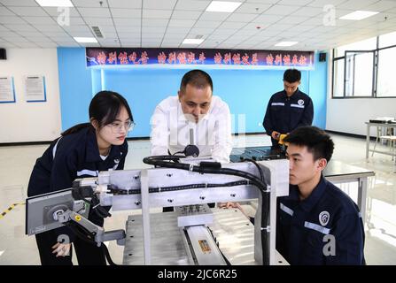 LUZHOU, CHINA - JUNE 3, 2022 - Teachers guide a team of the Luzhou ...