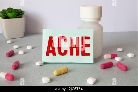 Wooden block form the word Ache with stethoscope on the doctor's ...