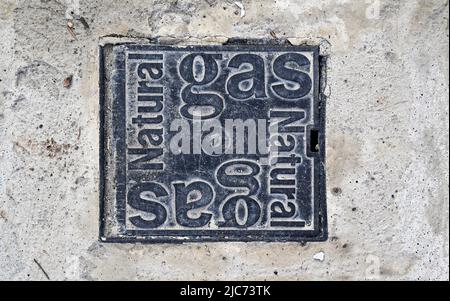 Gas manhole cover in pavement Stock Photo - Alamy