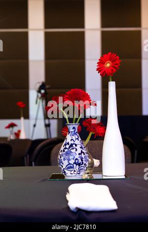 Beautiful table setting with red rose, paper heart and gift box on ...