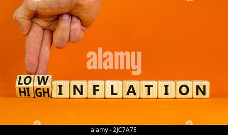 High or low inflation symbol. Businessman turns cubes and changes ...