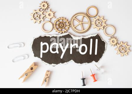 White paper with text PAYROLL isolated on blue background Stock Photo ...