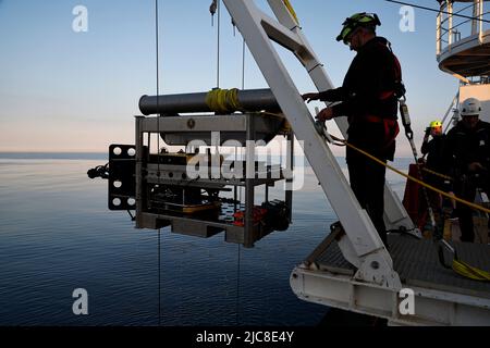 ROV, remotely operated vehicle being launched in the sea Stock Photo ...