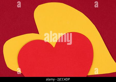 colored paper heart on colorful background Stock Photo - Alamy