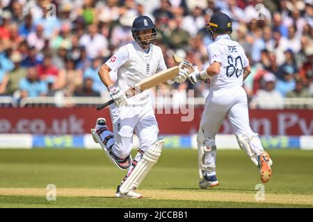 Joe Root and Ollie Pope of England chat as they leave the field at the ...